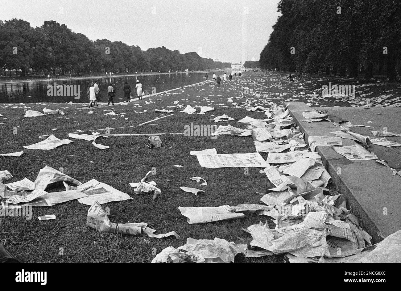 Discarded signs and other debris litter the ground between the Lincoln ...