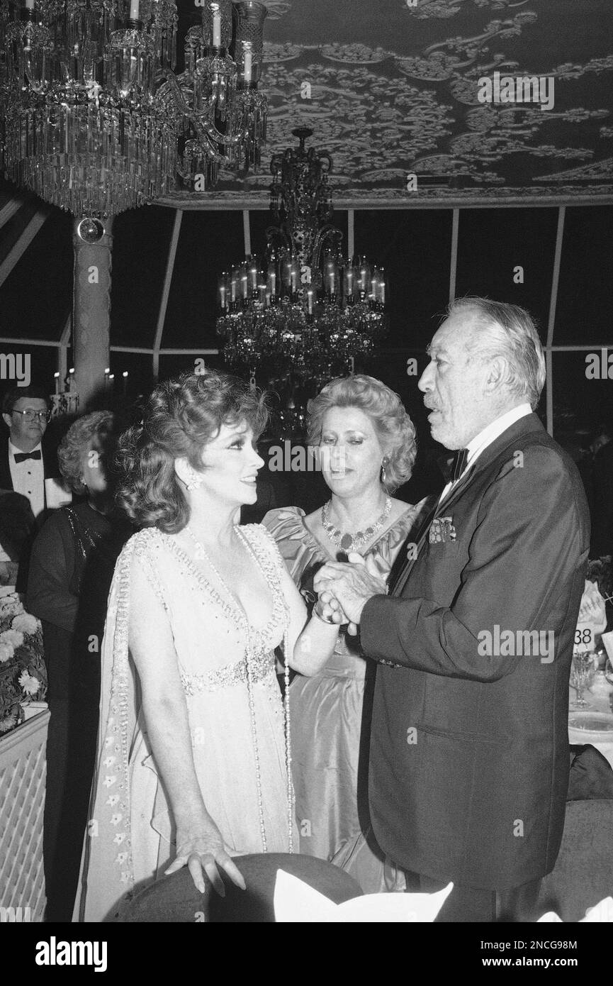 Actress Gina Lollobrigida, left, greets actor Anthony Quinn and his ...