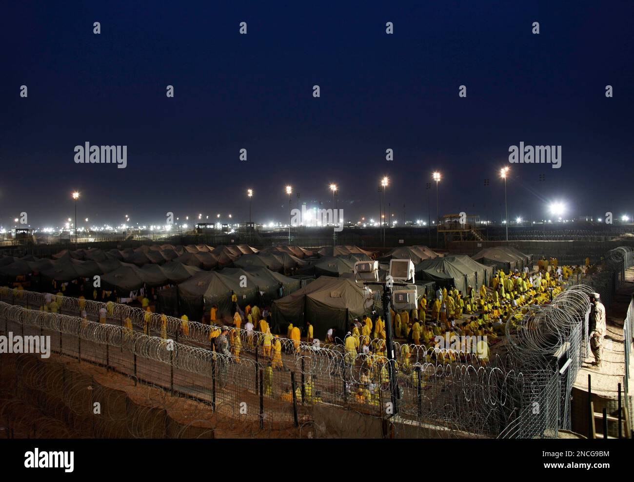 FILE - In this March 16, 2009 file photo, detainees pray at U.S ...