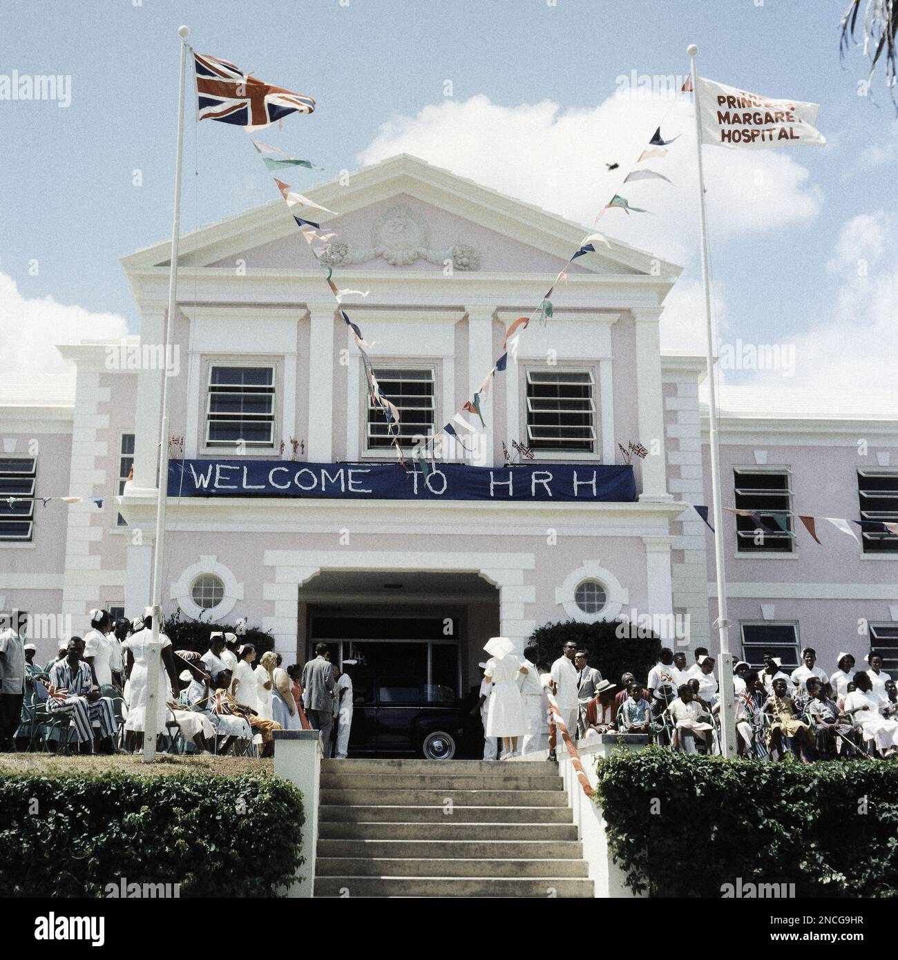 Patients wait outside the Princess Margaret Hospital in Nassau, in the ...