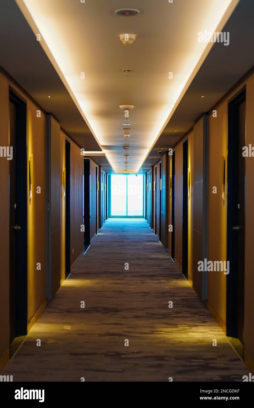 Empty hotel corridor in warm color tone Stock Photo - Alamy