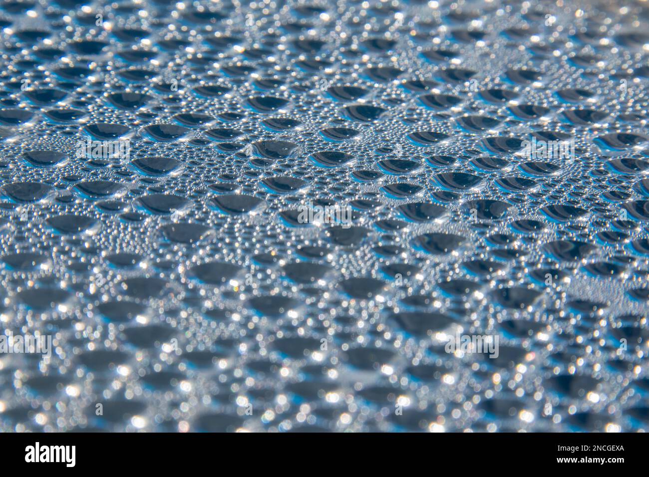 Water droplets on a glass surface for background, wall art or more ...
