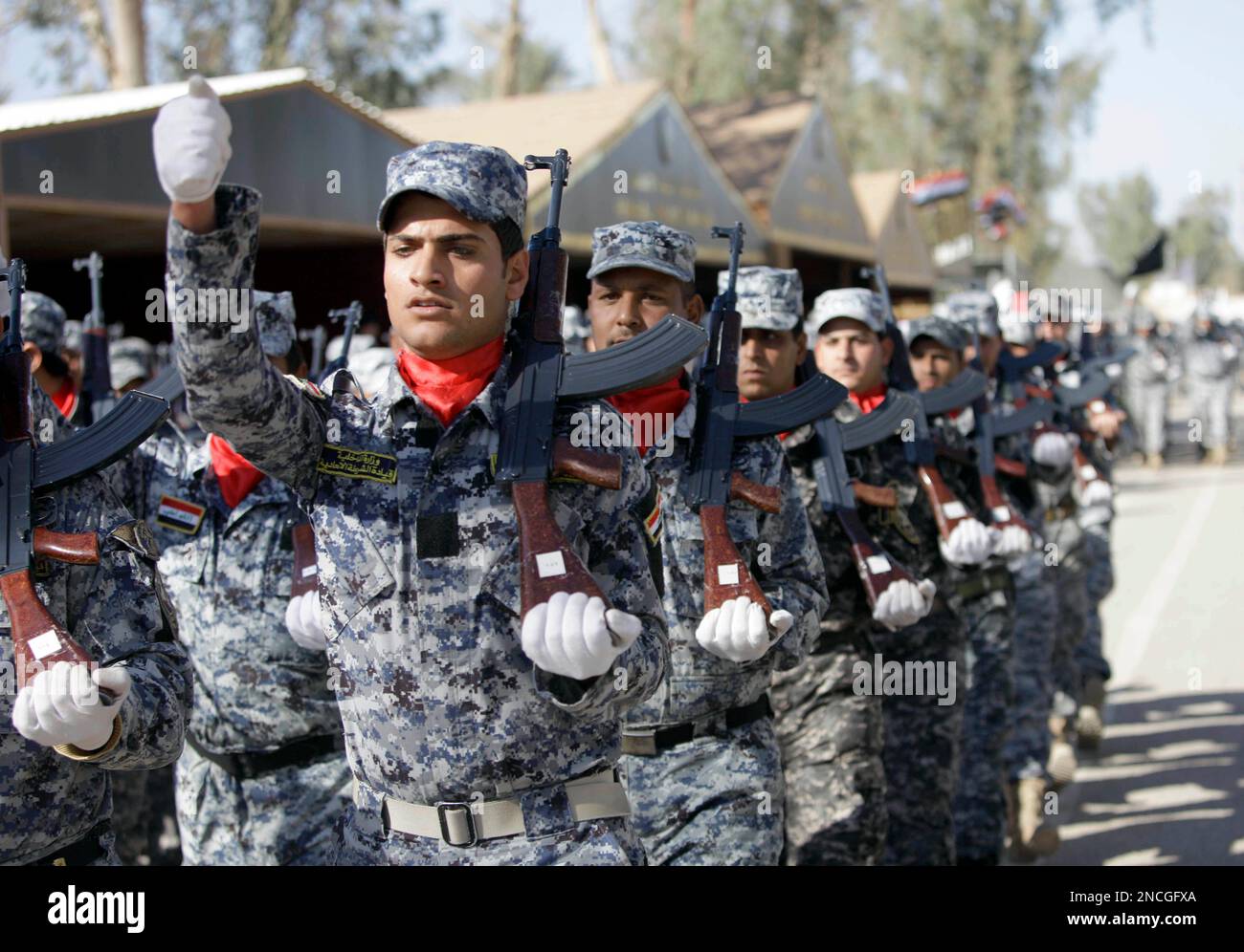 Iraqi federal police march during a graduation ceremony in Baghdad ...