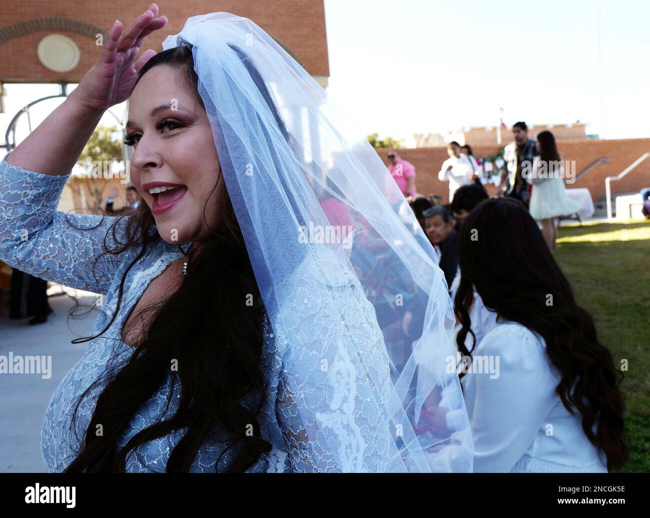 Wearing her white wedding dress and veil, Crystal Garcia, 31, prepares ...