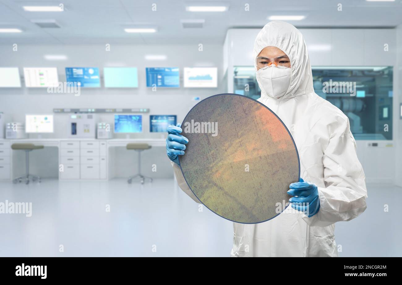 Worker or engineer wears medical protective suit or white coverall suit ...