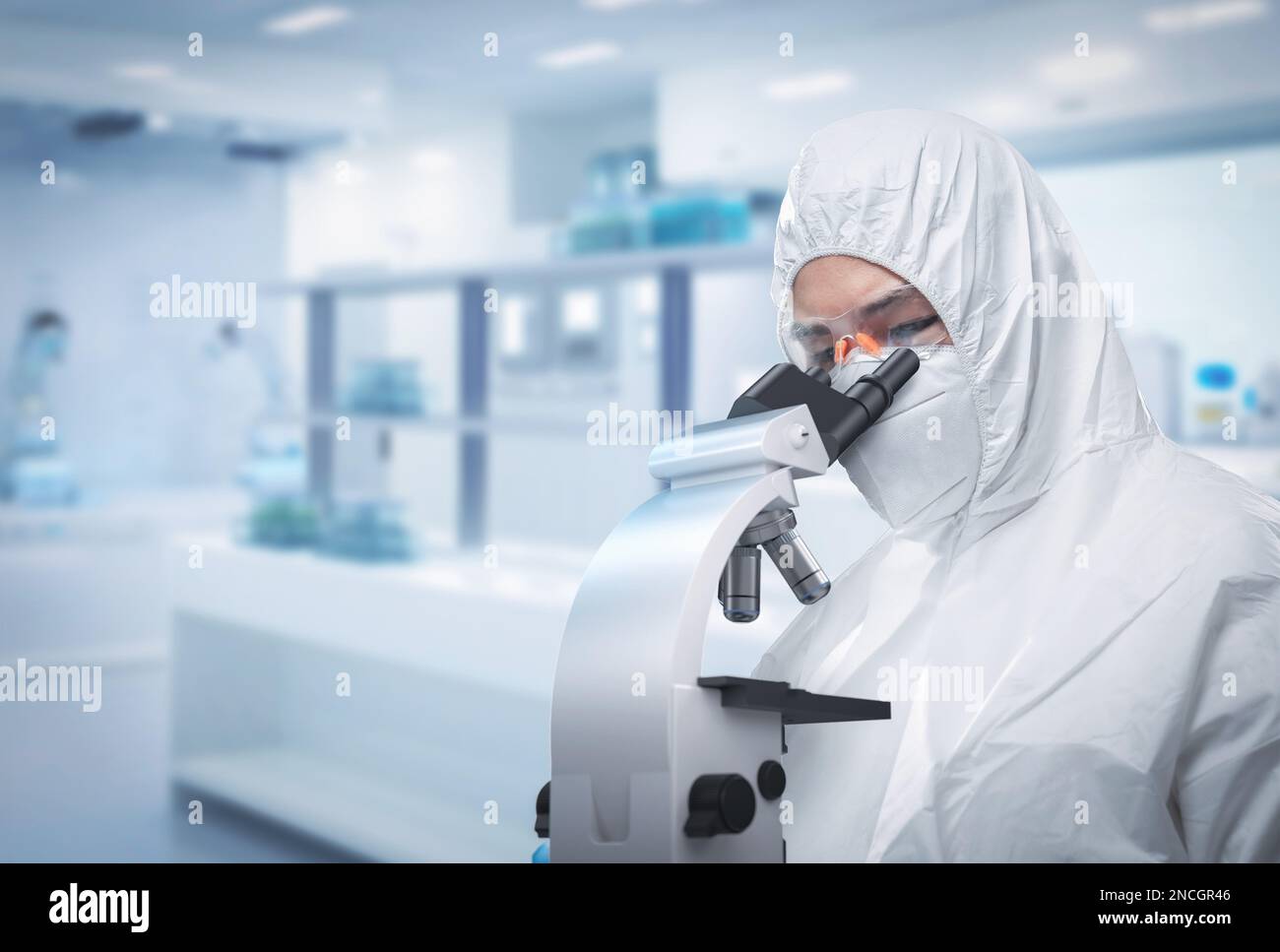 Worker wears medical protective suit or white coverall suit with mask ...