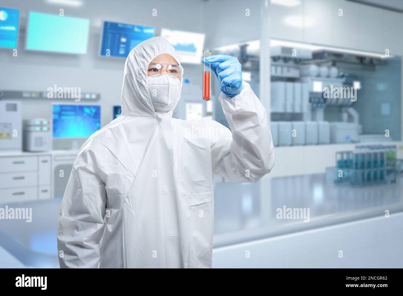 Worker wears medical protective suit or white coverall suit with test ...