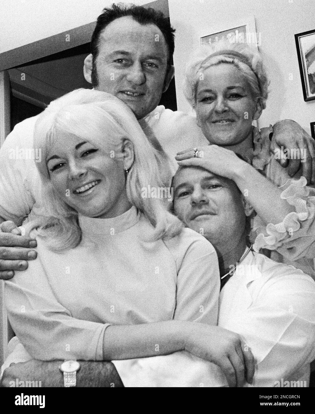 Dr. Sam Sheppard, right, poses with his new family, his bride, Colleen ...