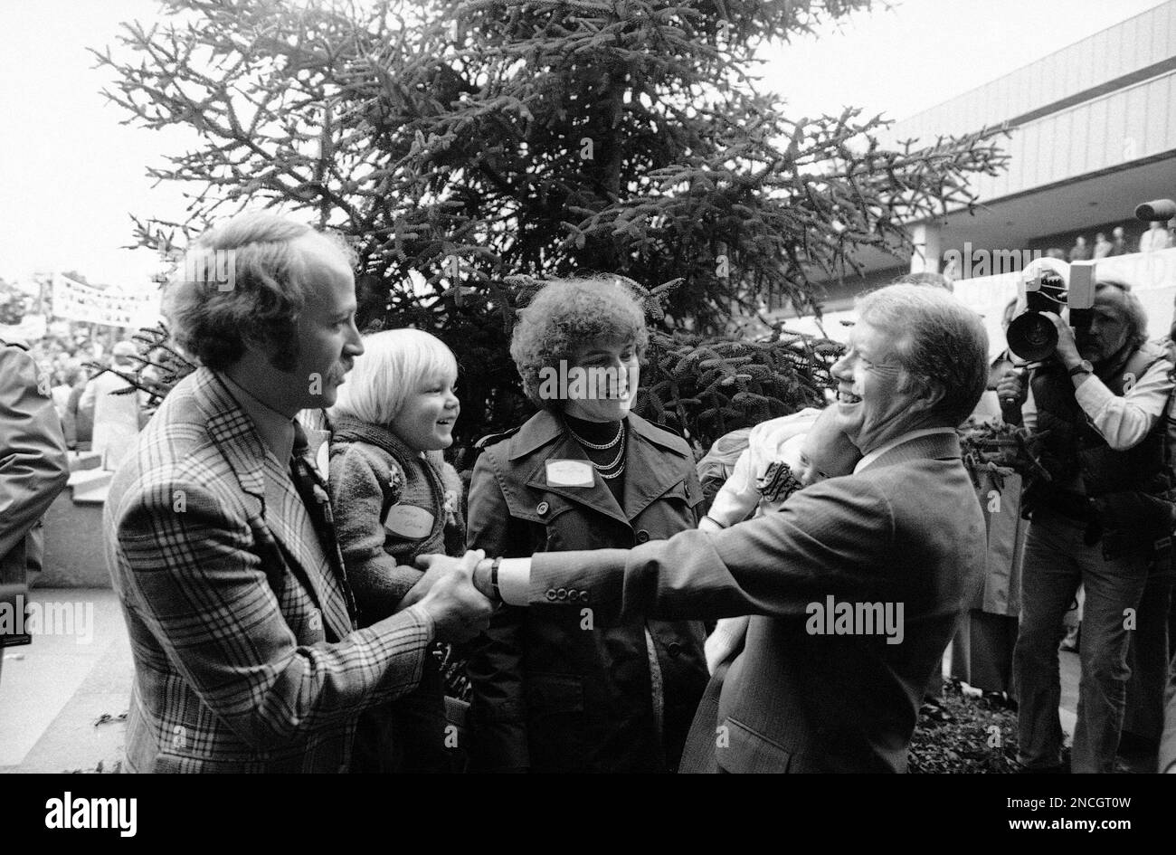 President Jimmy Carter exchanges greetings with the Olson family while ...