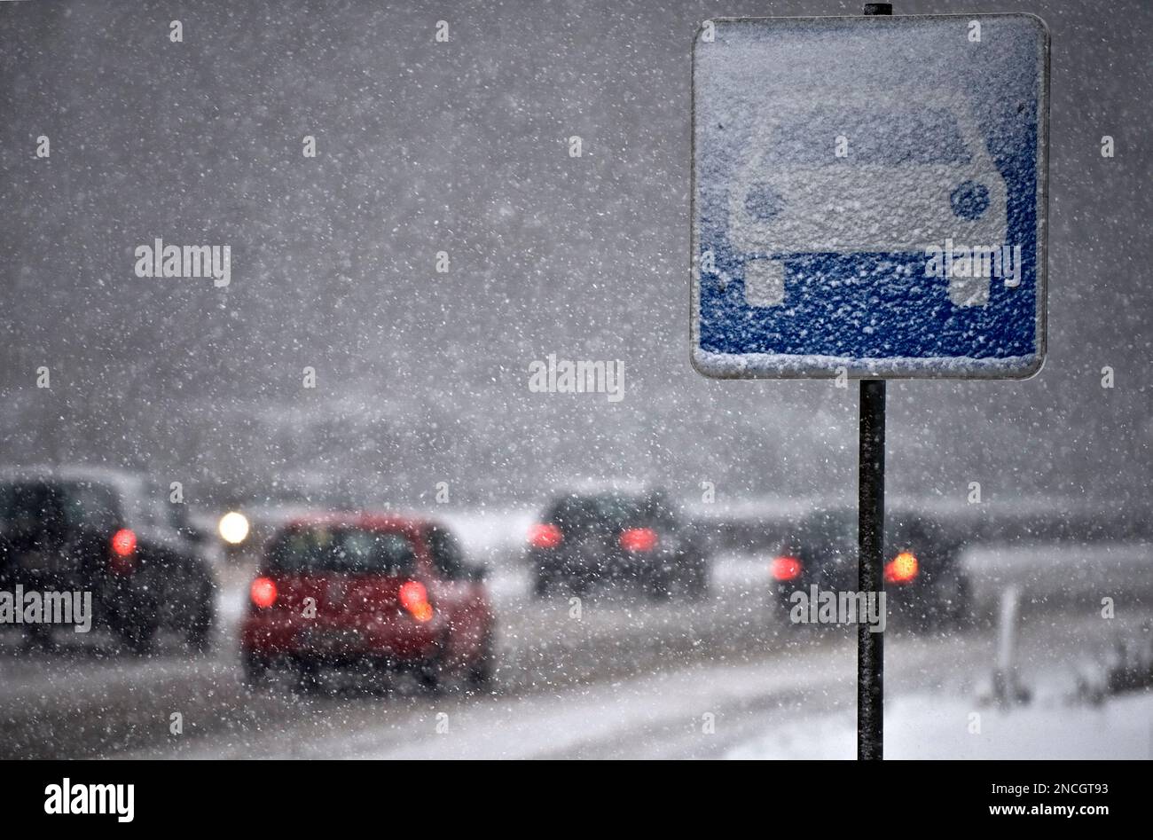 A German Autobahn sign is pictured during heavy snowfalls at the ...