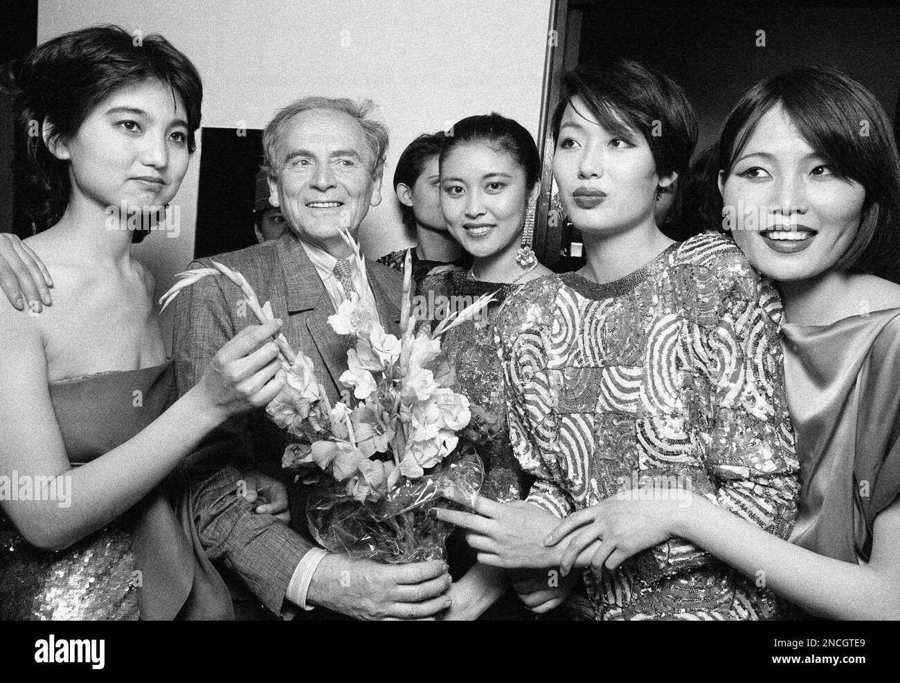 French fashion mogul Pierre Cardin pauses for a picture surrounded by ...