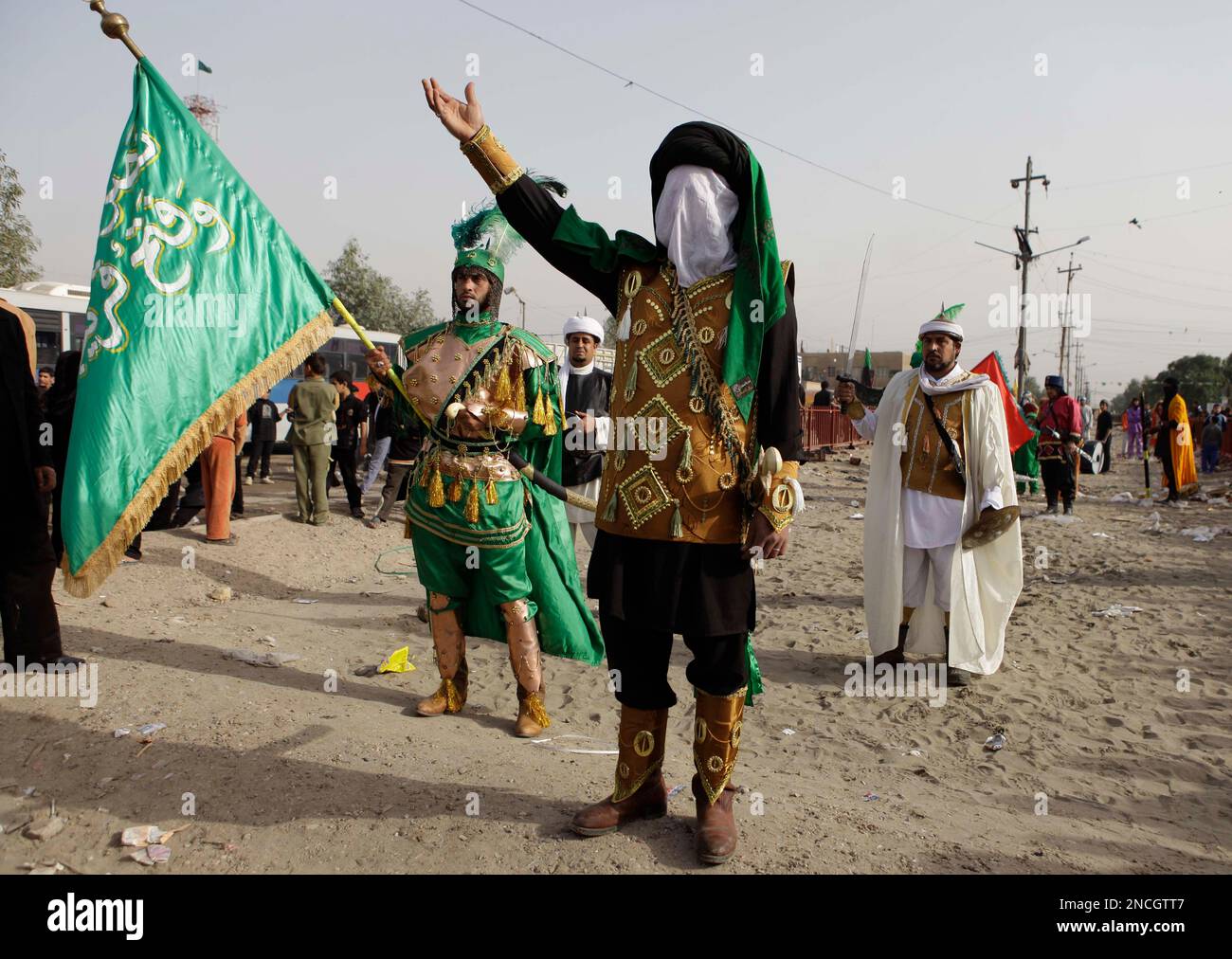 Iraqi Shiite Muslims re-enact the Battle of Karbala during Muharram, a ...