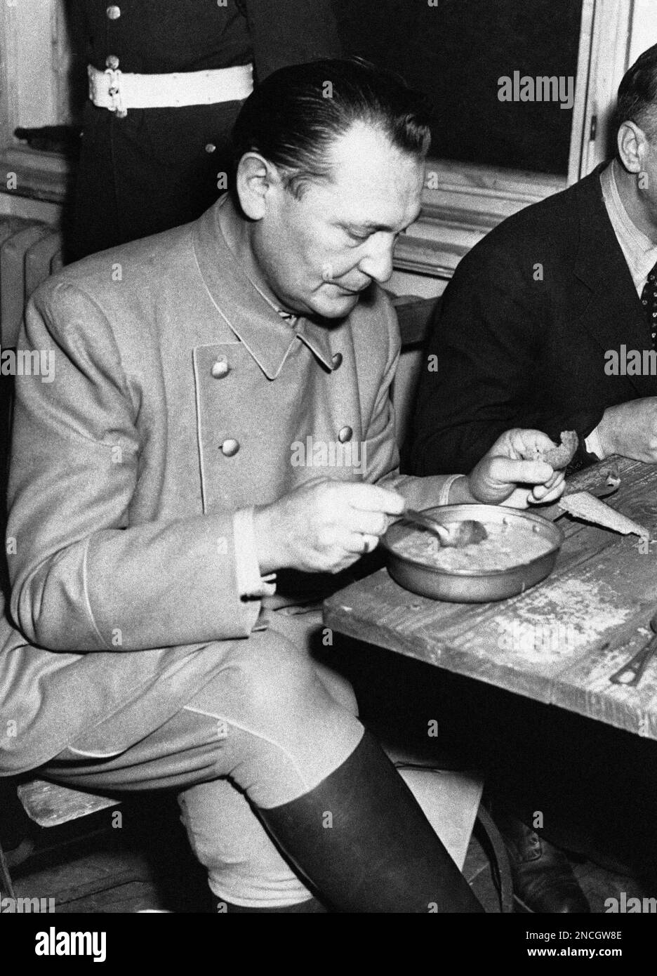Nazi war crime prisoner Hermann Goering eating his stew from an ...