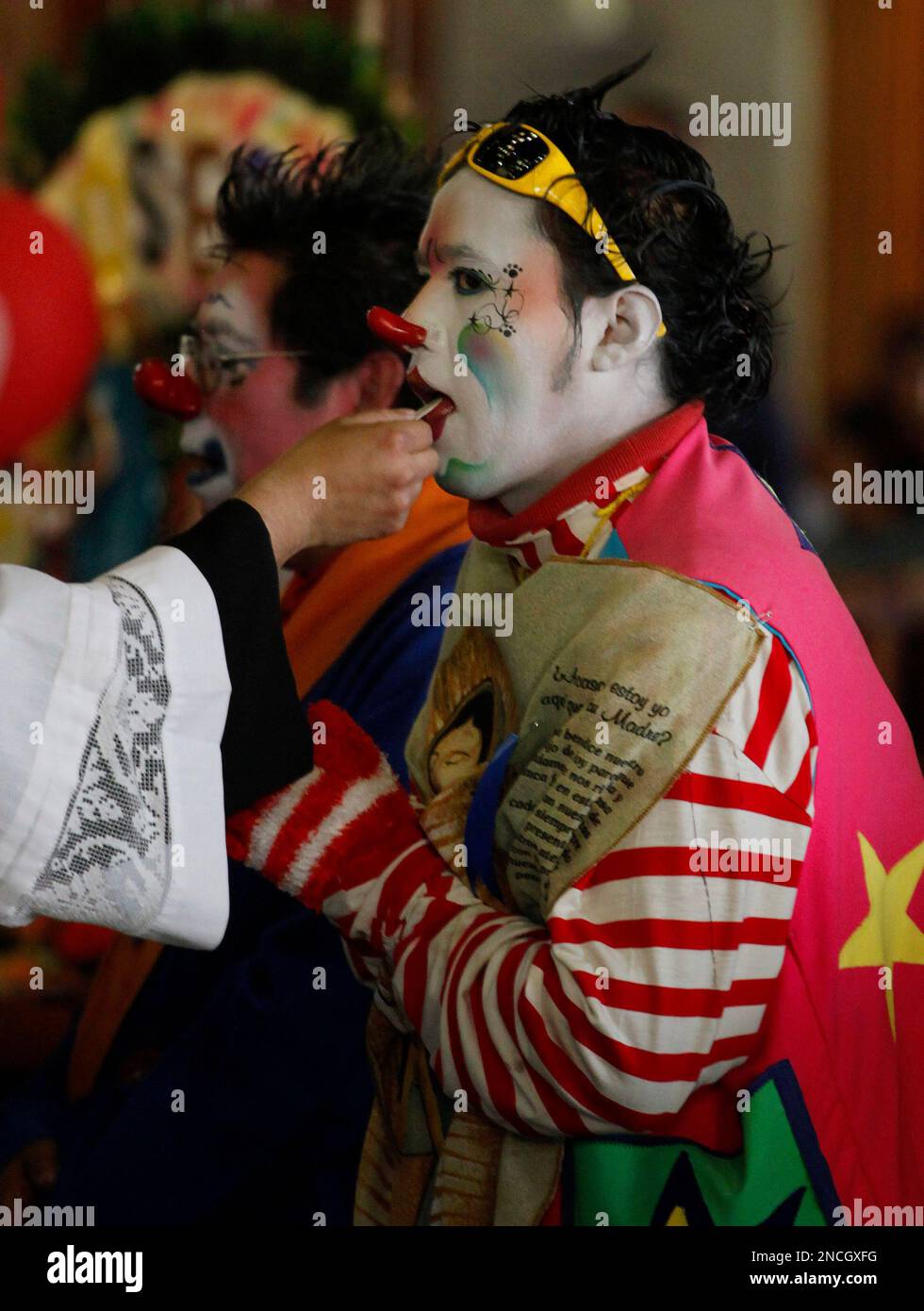 A clown receives communion during mass at the Basilica of Guadalupe in ...
