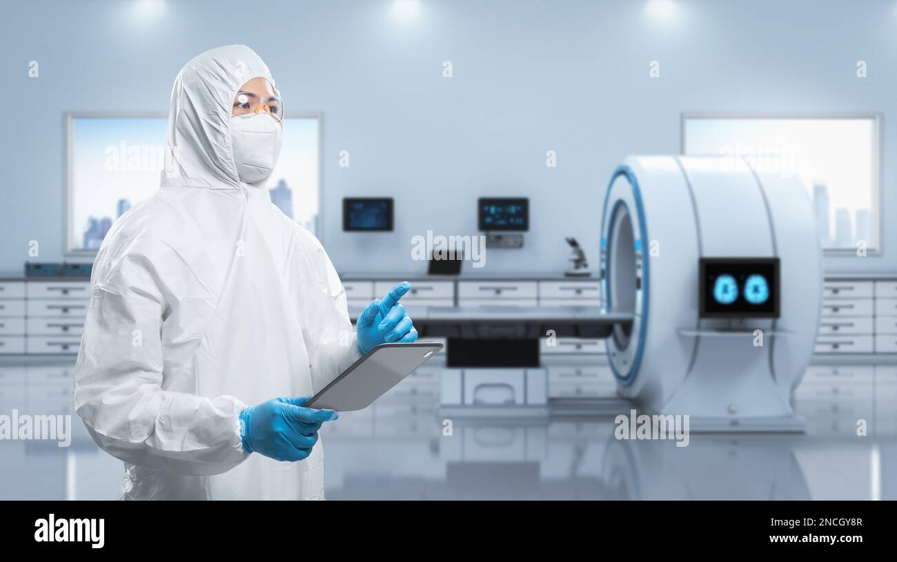 Doctor wears medical protective suit or white coverall suit with x-ray ...