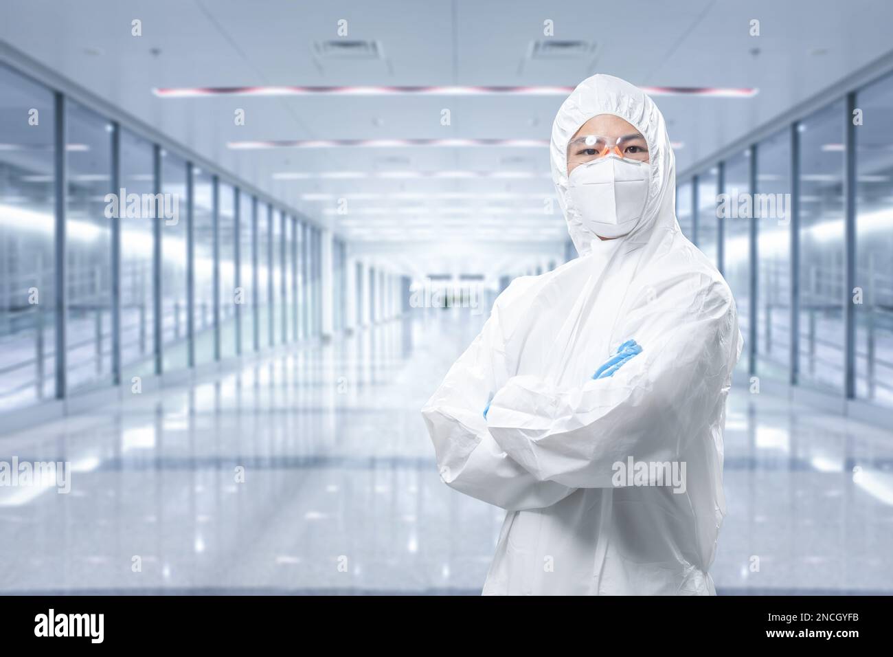 Worker wears medical protective suit or white coverall suit with mask ...