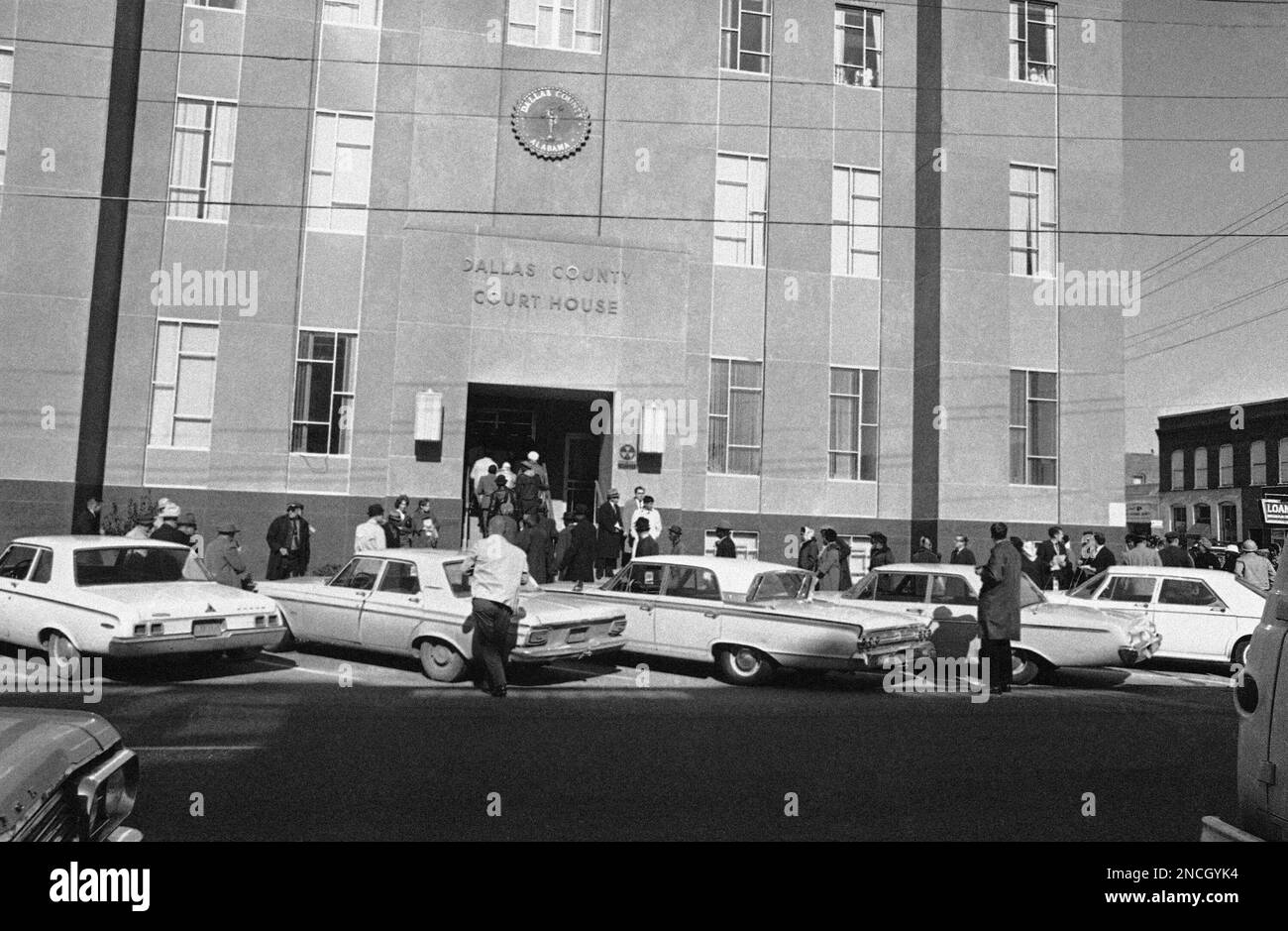 A long line of African Americans await their turn to enter the Dallas ...