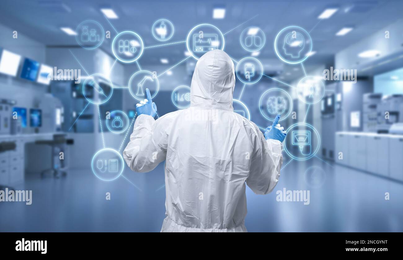 Doctor wears white protective suit hi-res stock photography and images ...