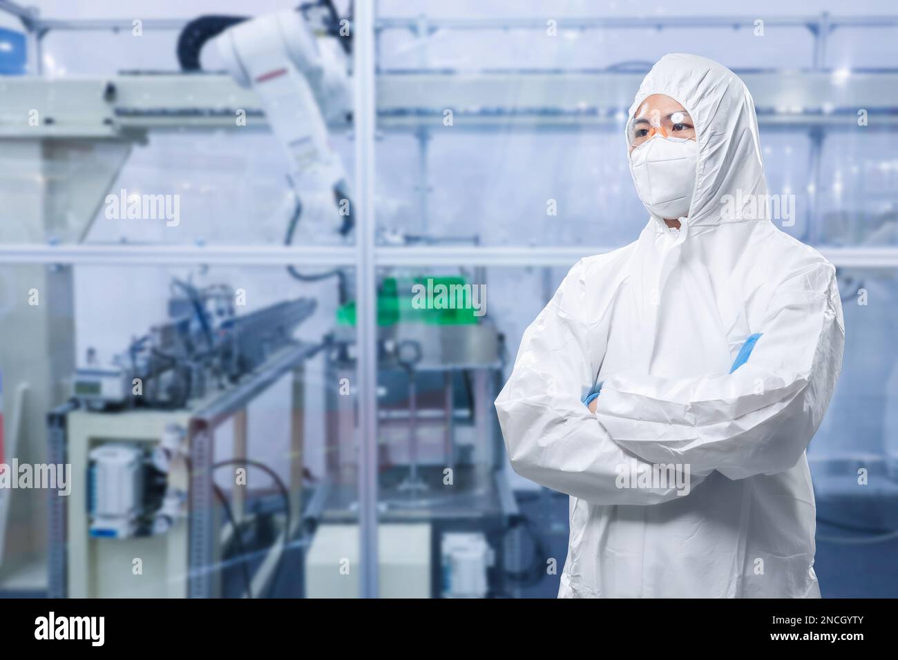 Worker or engineer wears protective suit or white coverall suit work in ...