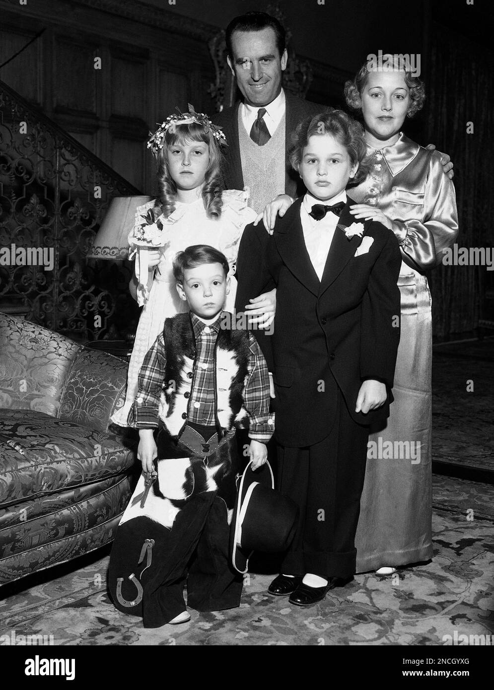 Harold Lloyd, film comedian, and his wife, the former Mildred Davis, are celebrating their 12th ...