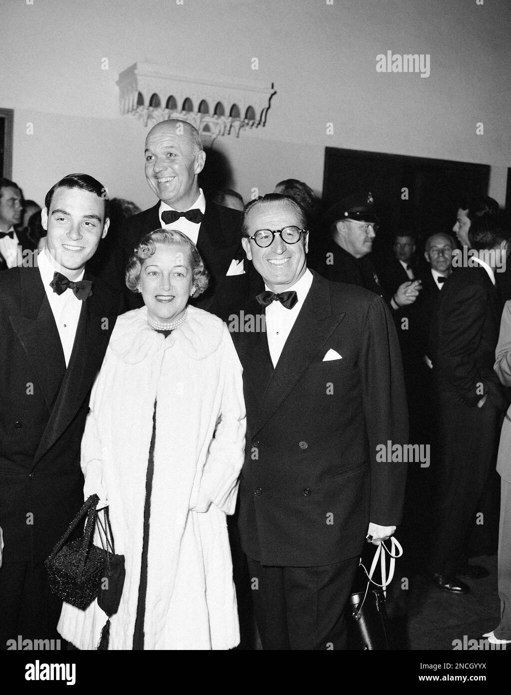 Comic Harold Lloyd, Mildred Lloyd, Harold Lloyd Jr., and Roy Brooks (tall man) arrive for ...