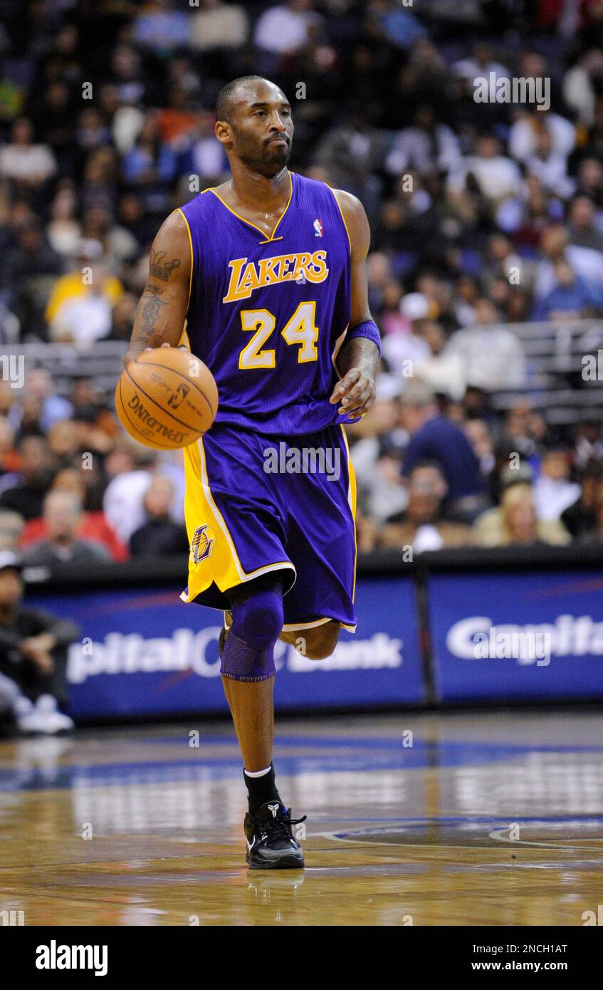 Los Angeles Lakers shooting guard Kobe Bryant brings the ball up court ...