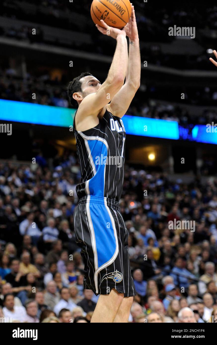 Orlando Magic guard J.J. Redick shoots against the Denver Nuggets ...