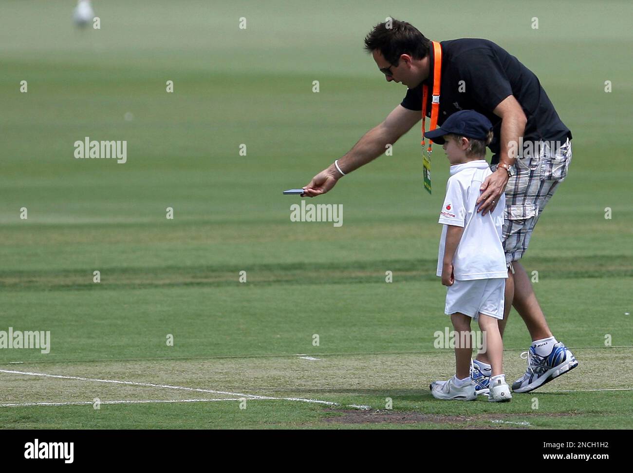Ex England Cricket captain Michael Vaughn, left, takes a photo of the ...