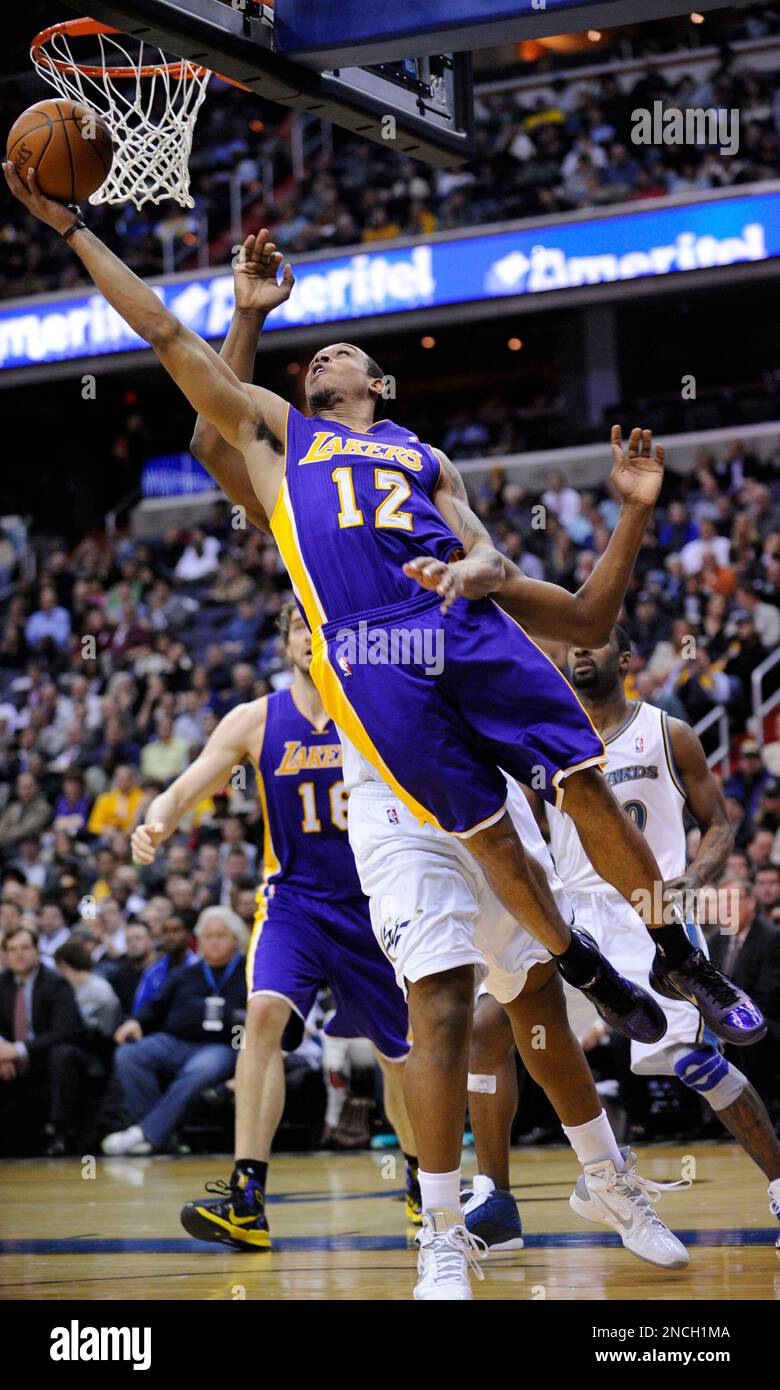 Los Angeles Lakers point guard Shannon Brown, front, goes to the basket ...