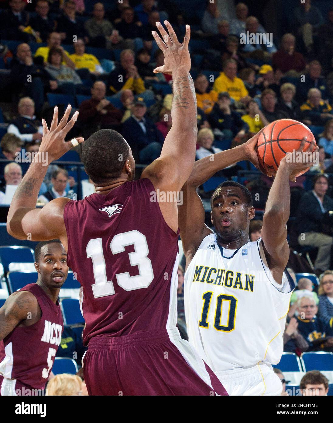 North Carolina Central forward David Best (13) defends Michigan guard ...