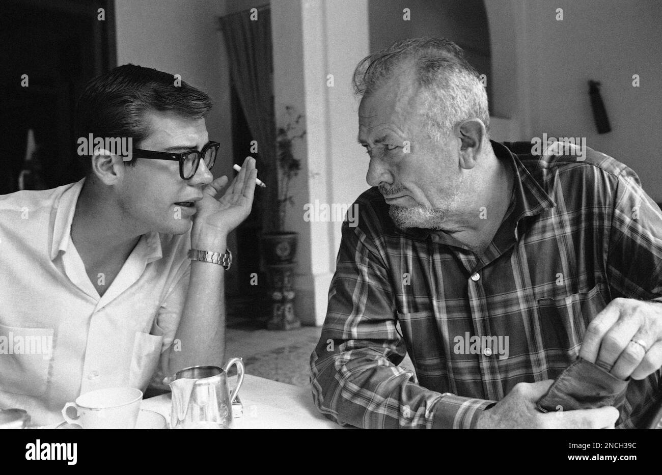Actor John Steinbeck talks with his 20-year old son, John, at a Saigon ...