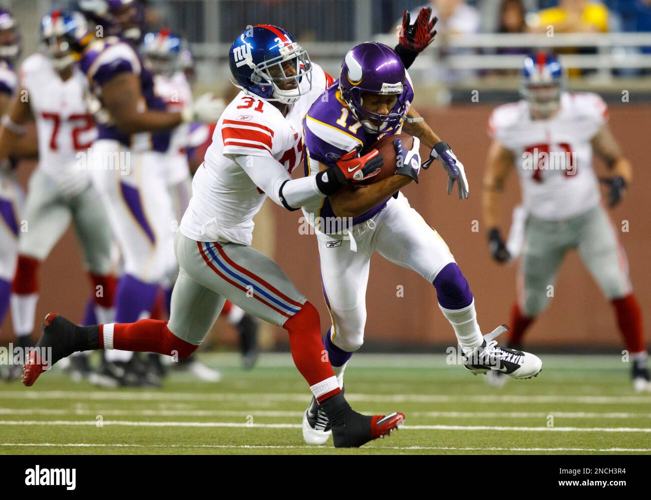Minnesota Vikings wide receiver Greg Lewis (17) is tackled by New York ...