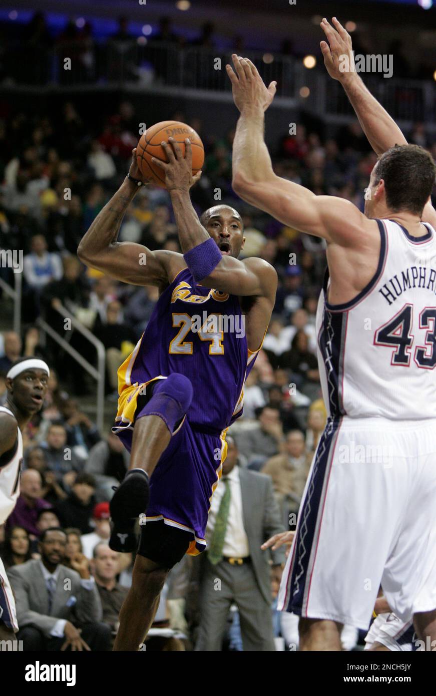 Los Angeles Lakers' Kobe Bryant (24) looks to the basket as New Jersey ...
