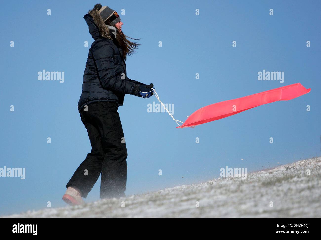 A gust of strong wind carries Camille Bratton's, 14, sled, Monday, Dec ...