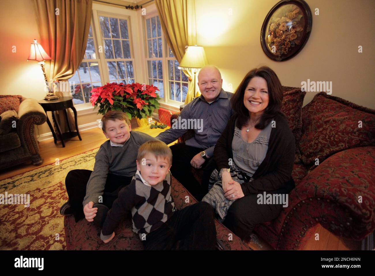 In this photo taken, Dec. 6, 2010, Andrew Craig, his wife Kelly, and ...