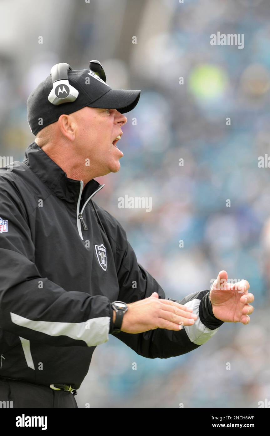 Oakland Raiders defensive line coach Mike Waufle calls out to his ...