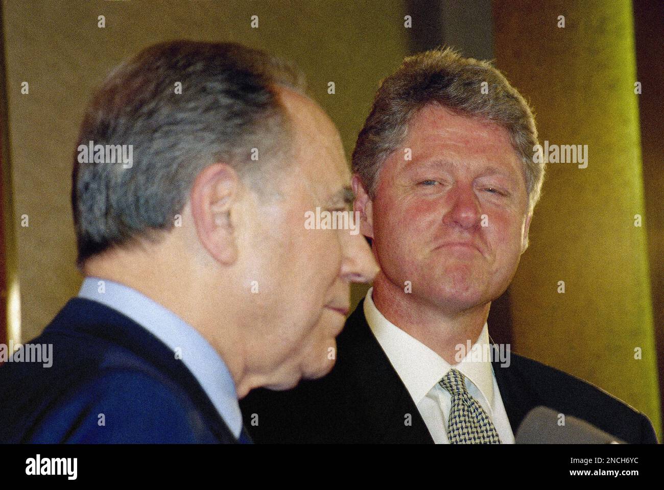 President Bill Clinton listens to Italian Prime Minister Carlo Azeglio ...