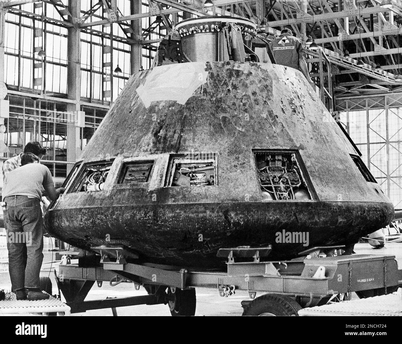 Apollo 8 moon capsule, showing obvious signs of its fiery re-entry, is ...