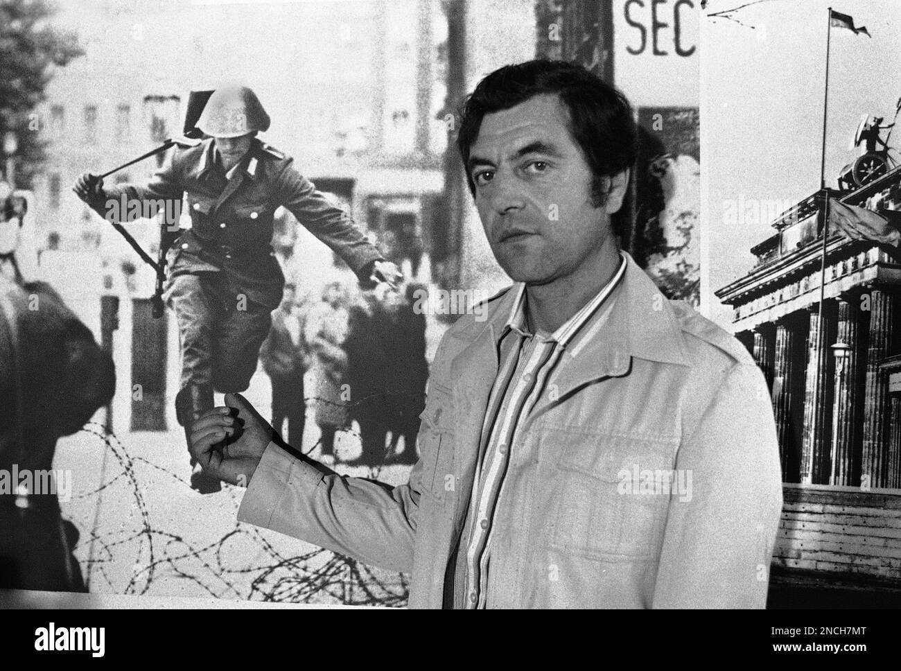 Conrad Schumann(39), former member of the East German Army, points on ...