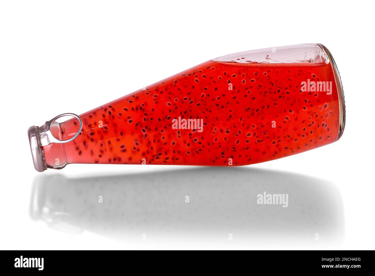 The red drinks with basil seeds or falooda seeds or tukmaria in bottles ...