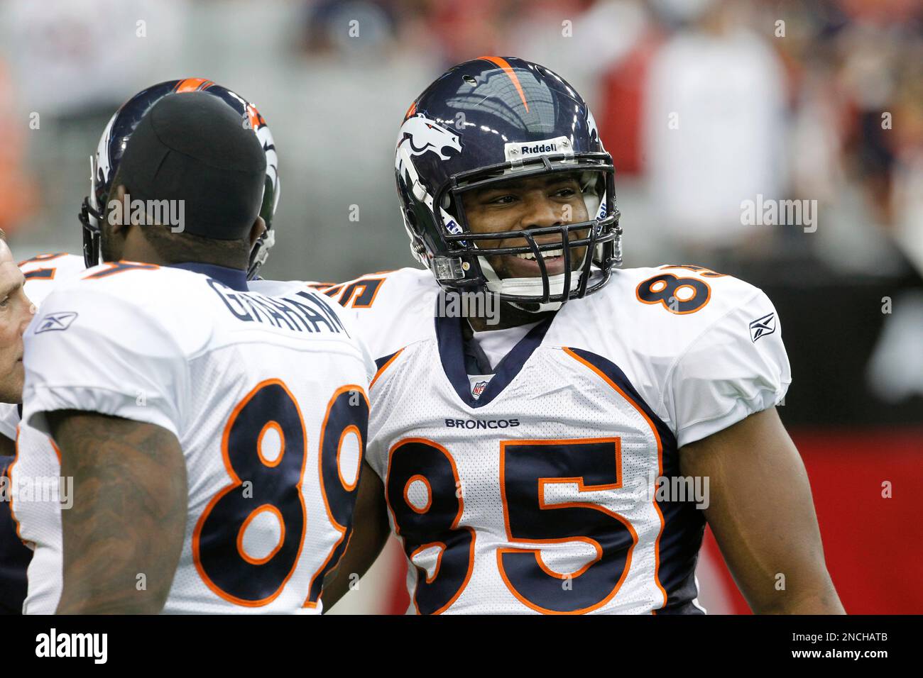 Denver Broncos' Daniel Coats (85) talks with teammate Daniel Graham (89 ...