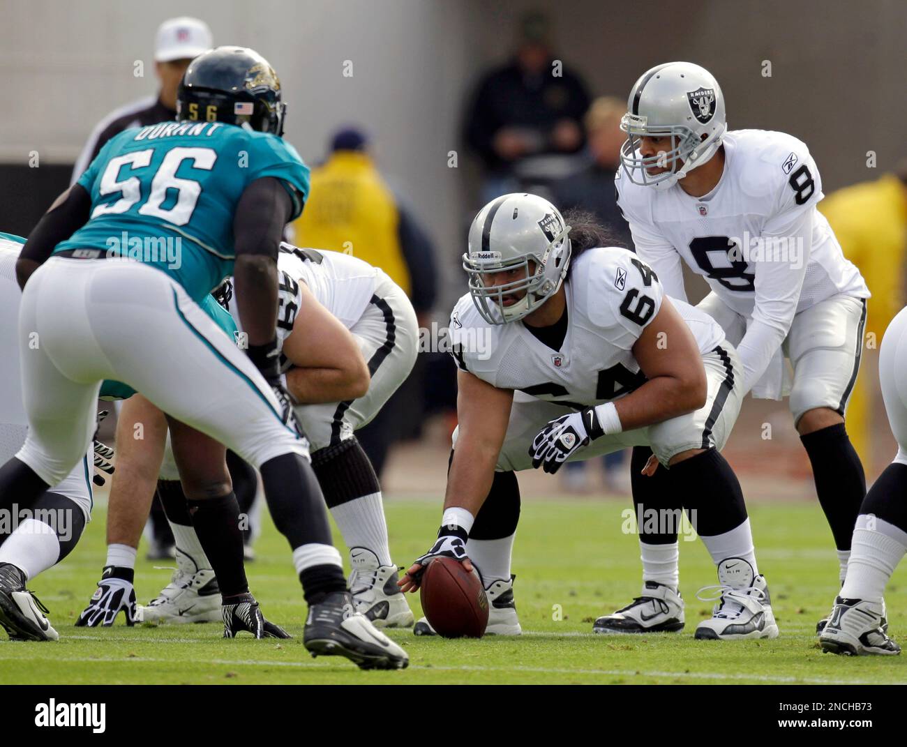 Oakland Raiders center Samson Satele (64) centers the ball to ...