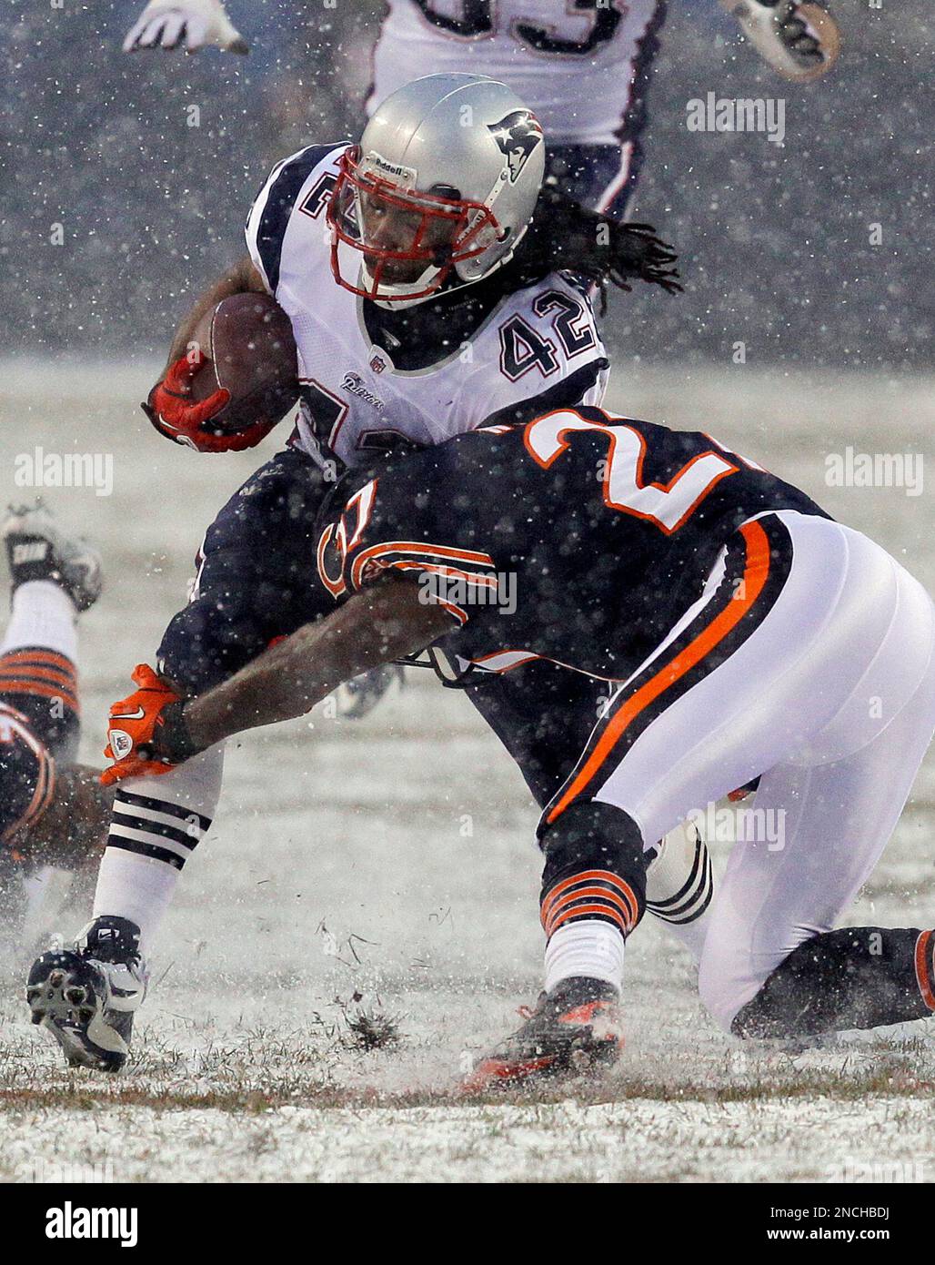 New England Patriots running back BenJarvus Green-Ellis (42) is tackled ...