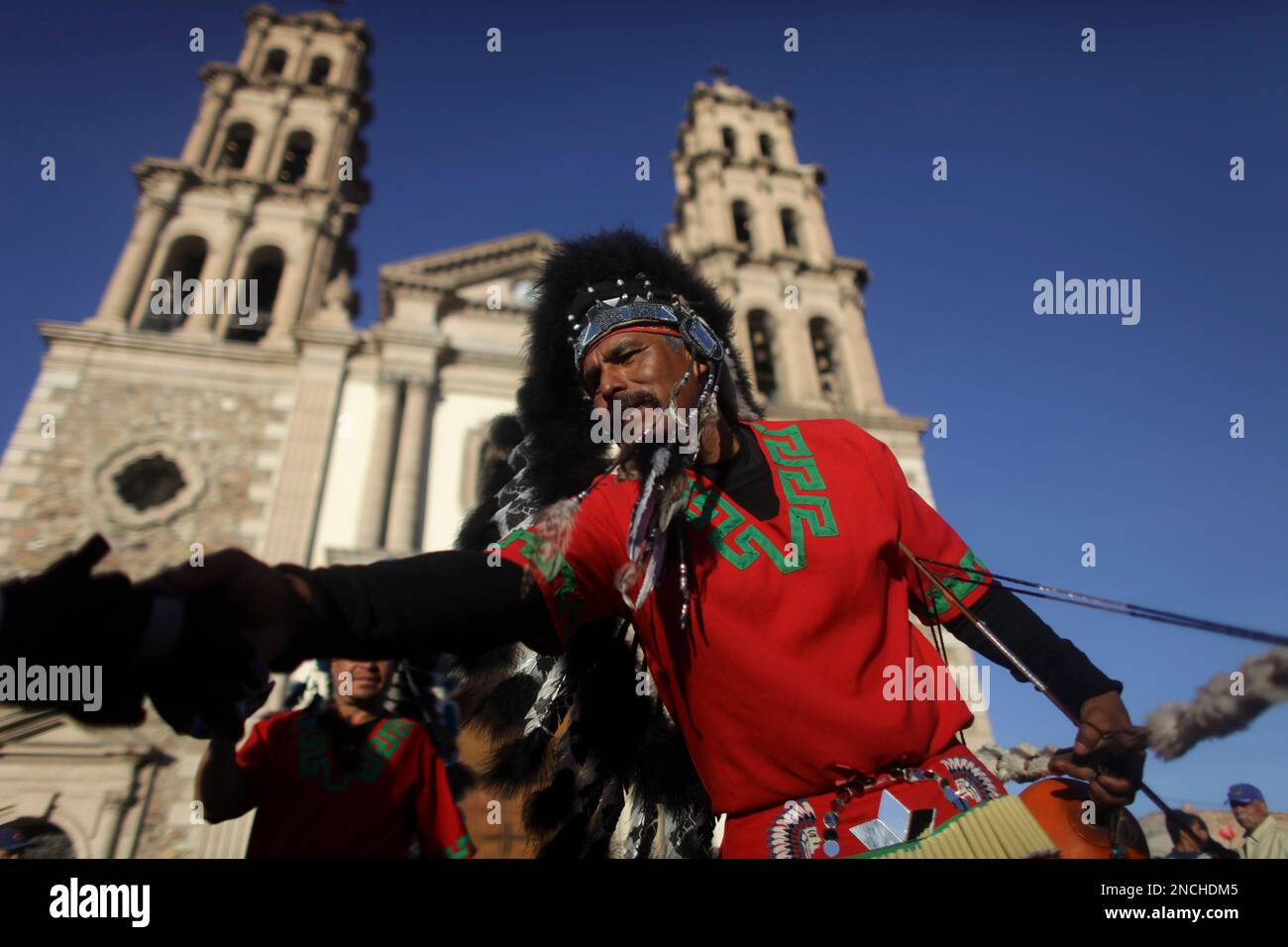 Traditional dancers known as "matachines" perform in front of the ...