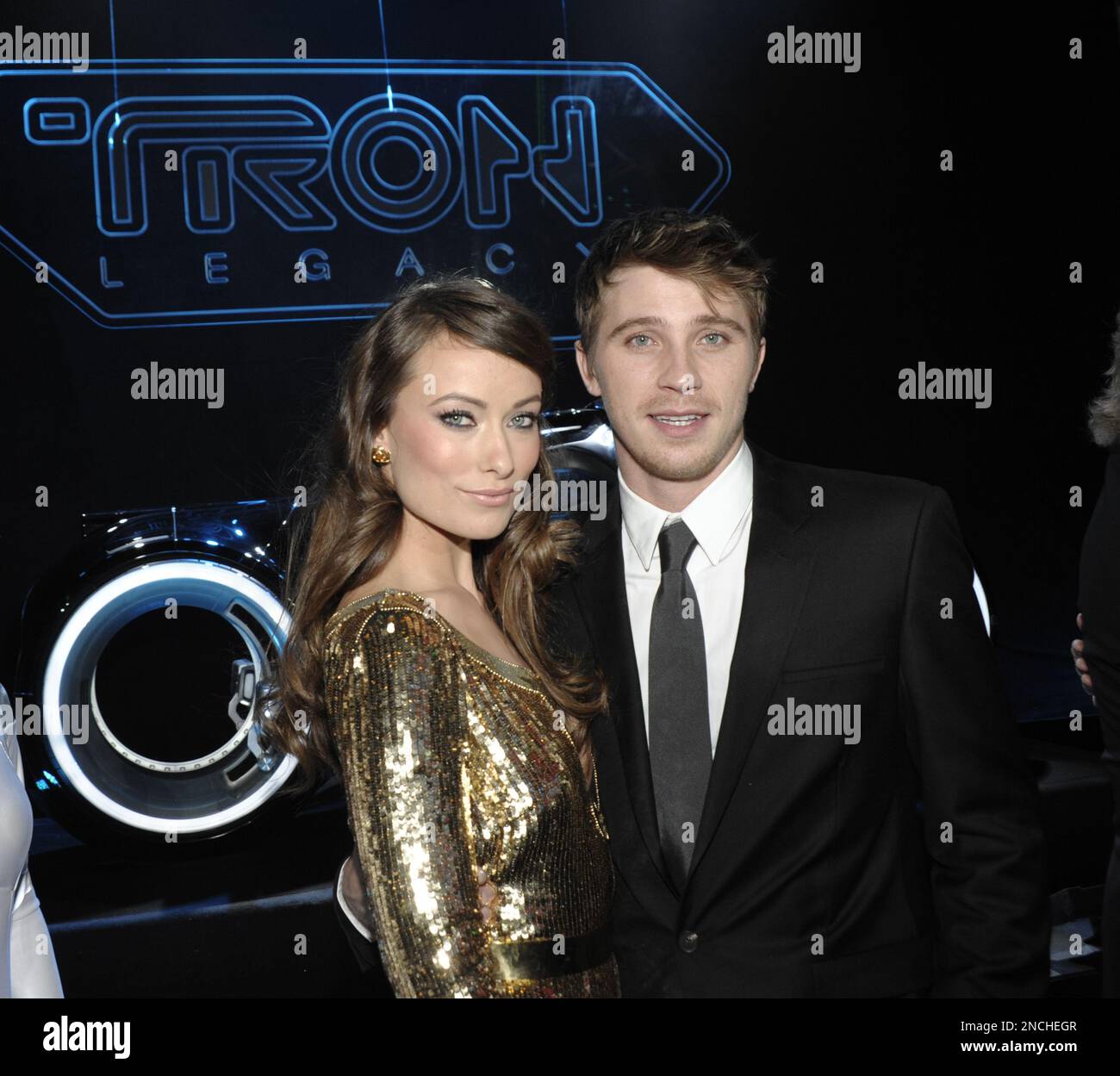 Actor Garrett Hedlund, right, and actress Olivia Wilde arrive at the ...