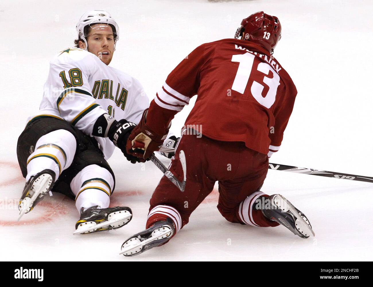 Phoenix Coyotes' Ray Whitney (13) checks Dallas Stars' James Neal (18 ...