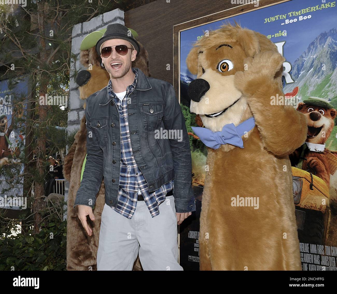 Actor Justin Timberlake, center, poses with characters Yogi and Boo Boo ...