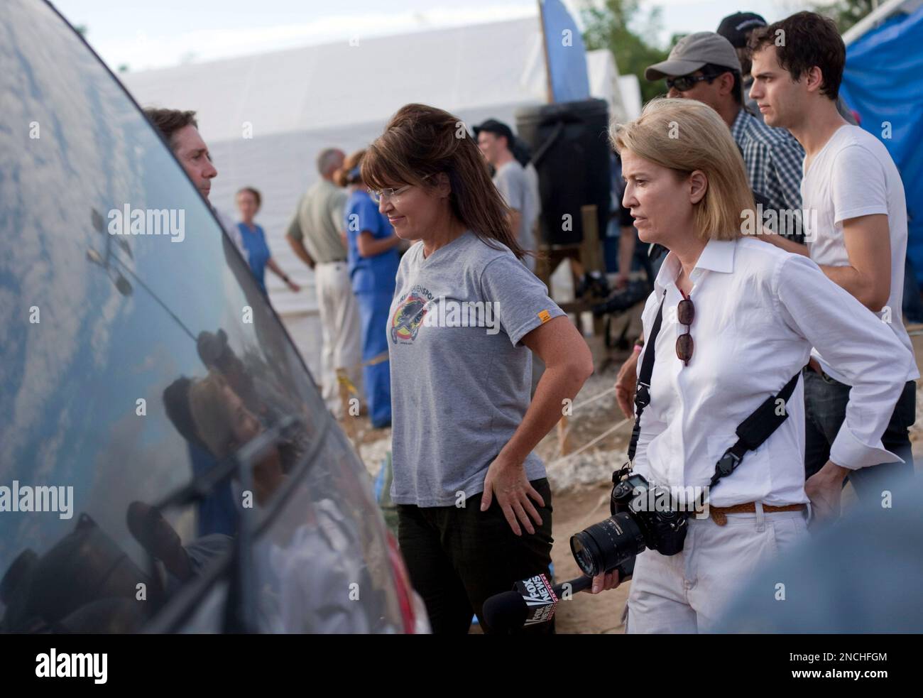 Former Alaska Gov. Sarah Palin, left, accompanied by Fox News Channel ...