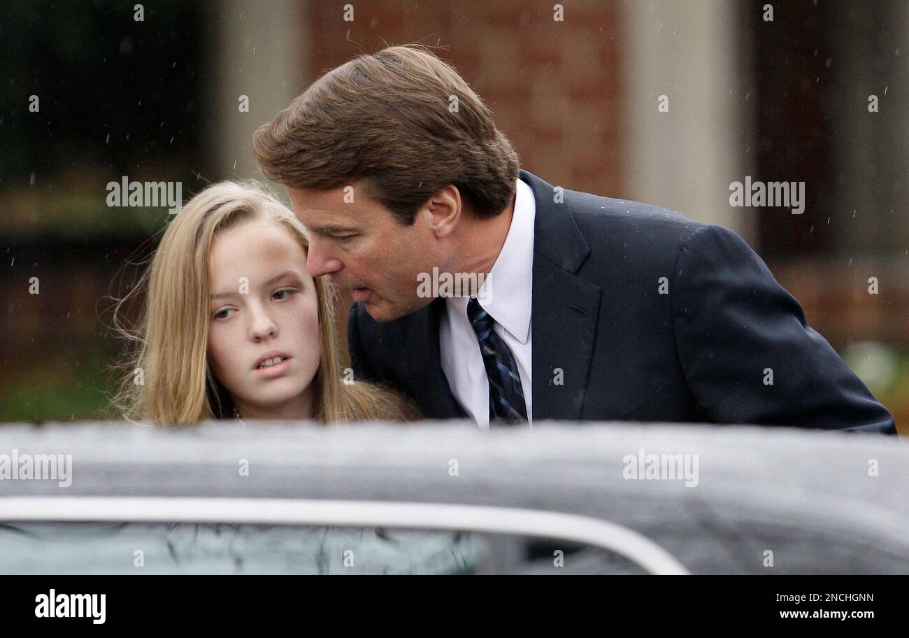 Former Democratic presidential candidate John Edwards comforts his ...