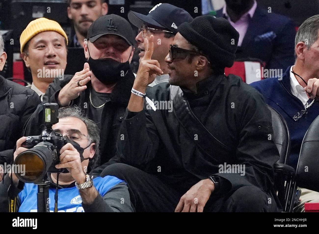 Actor Leonardo DiCaprio, second from left, and rapper Q-Tip chat during ...